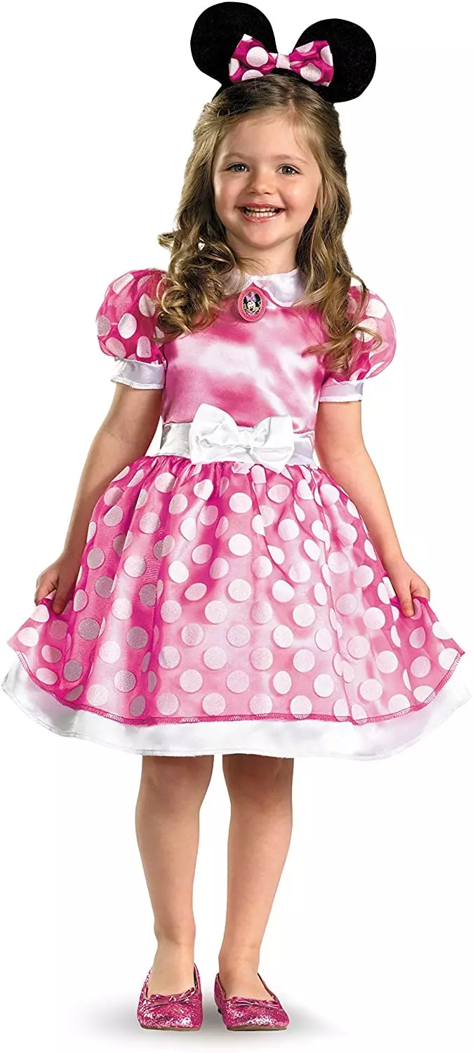 Nen amb un vestit rosa de Minnie Mouse i les orelles