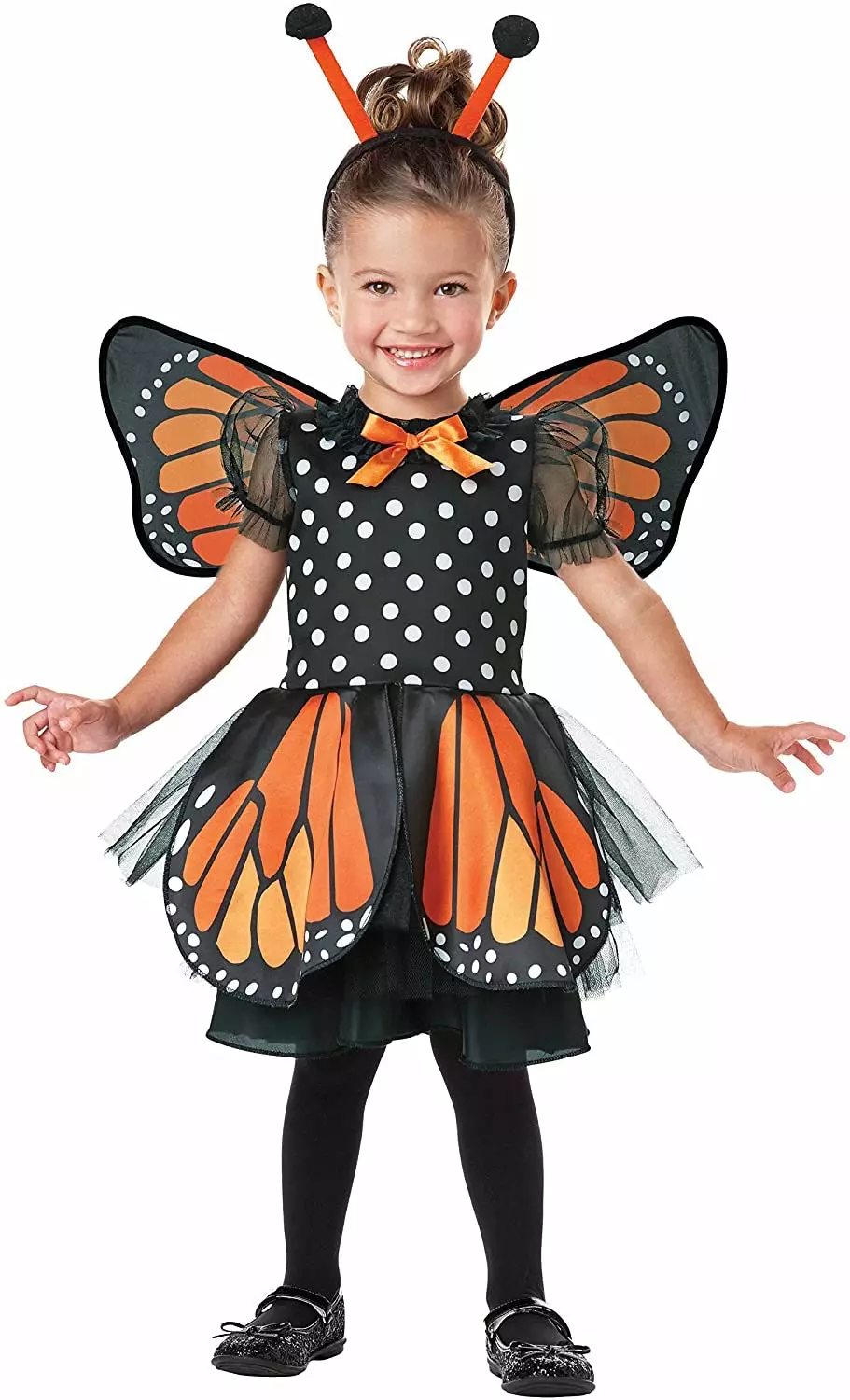 Peutermeisje gekleed in vlinderkostuum